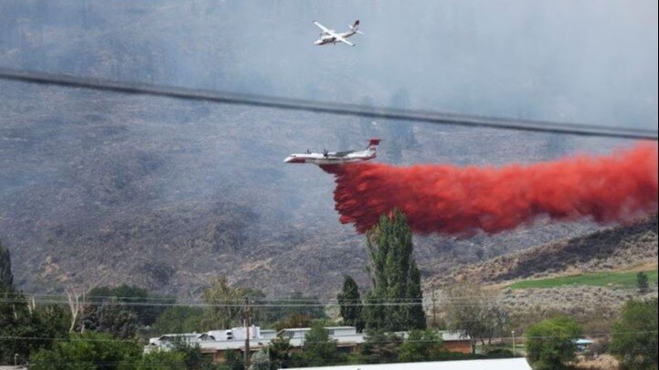 US wildfire crosses border, evacuation order issued for western ...