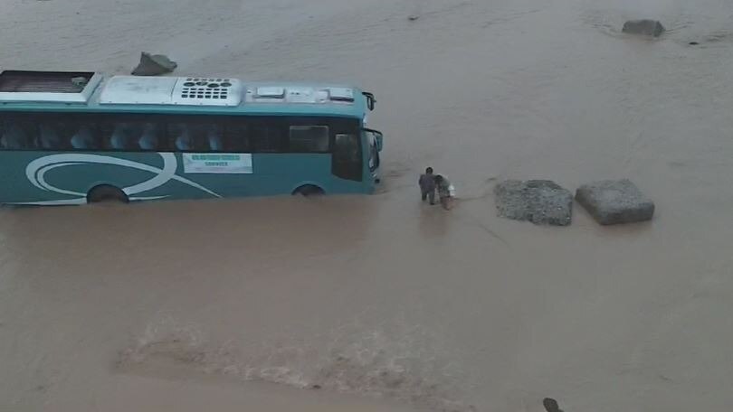 Watch: 53 rescued after bus gets stuck in fast-flowing river in ...