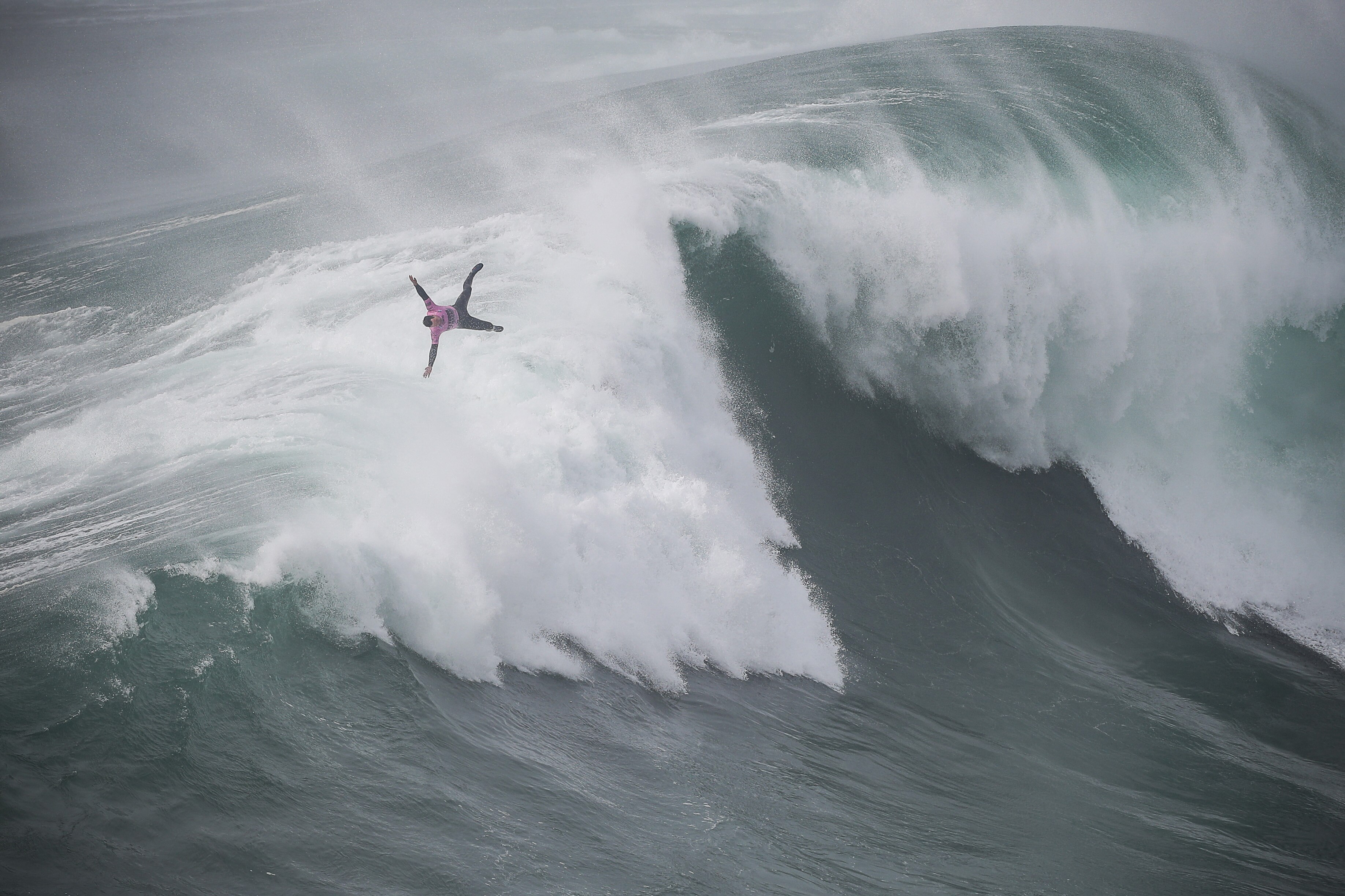 World’s best surfers take on giant waves during Nazaré Tow Surfing ...