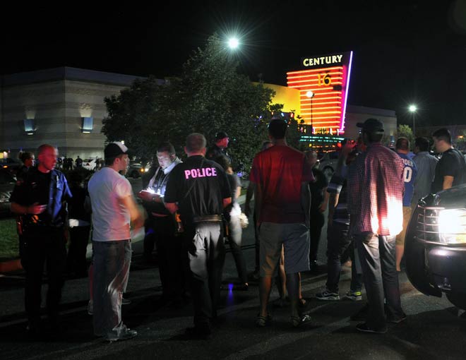 At least 14 killed on 'dark night' in US as gunman opens fire at Batman ...