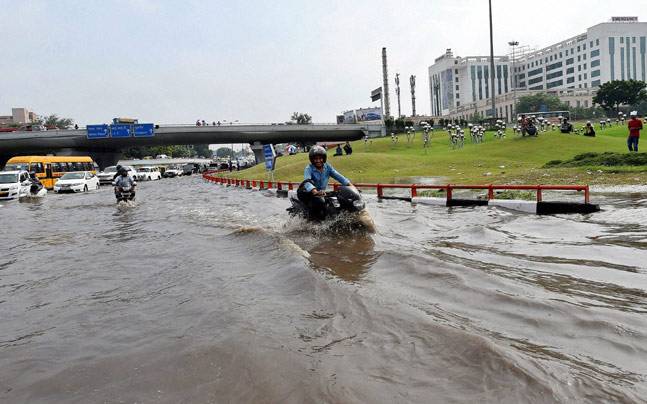 Delhi rains: Road from India Gate towards Ashoka Road caves in, traffic ...