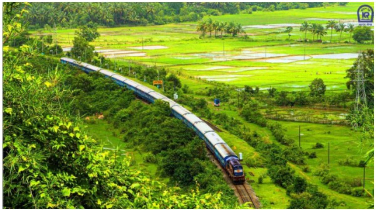 Train crosses scenic Karnataka station in backdrop of lush green fields ...