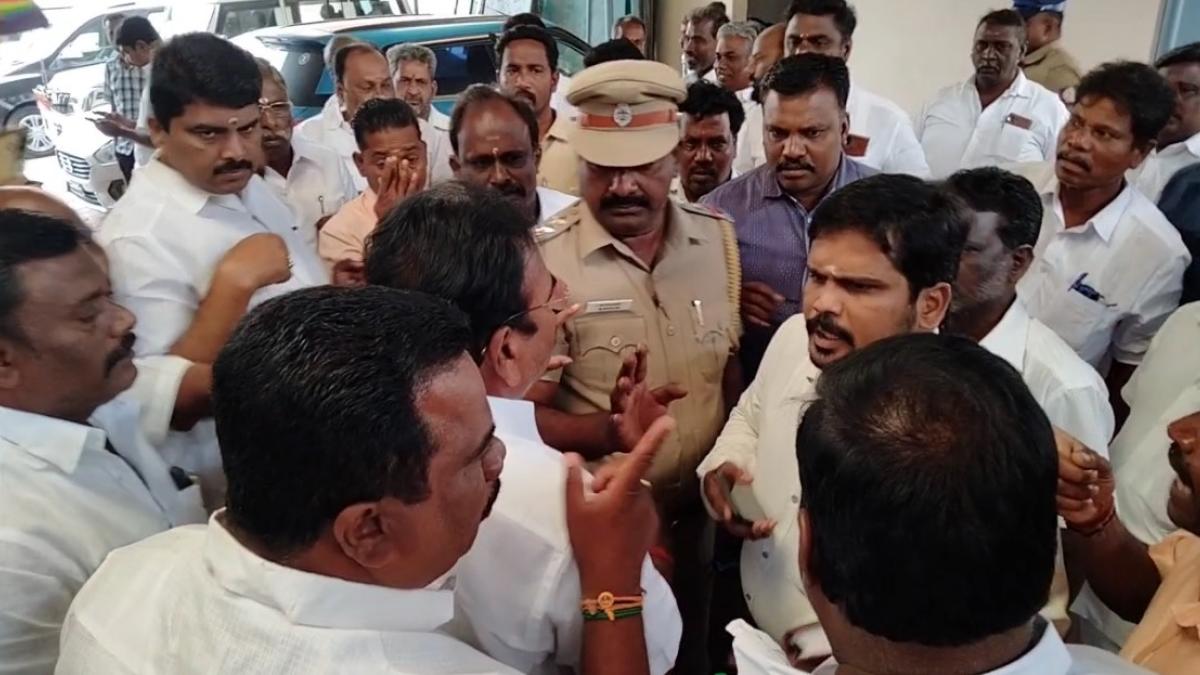 Erode bypolls: Election officials crack down on AIADMK members holding ...