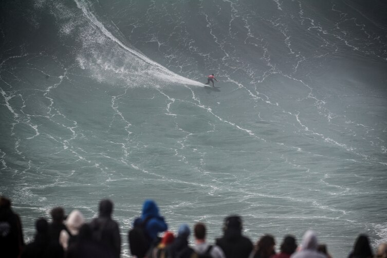 World’s best surfers take on giant waves during Nazaré Tow Surfing ...