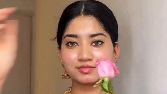 A rose-kissed bridal hairstyle straight out of a dream