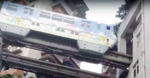 Watch: This train runs through a building in China's Mountain City ...