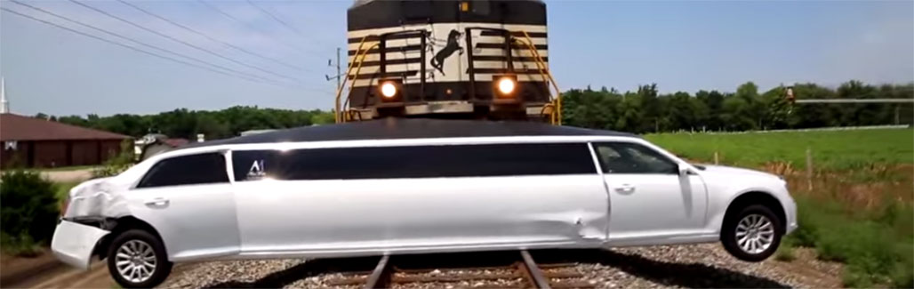 Limo struck by freight train caught on video