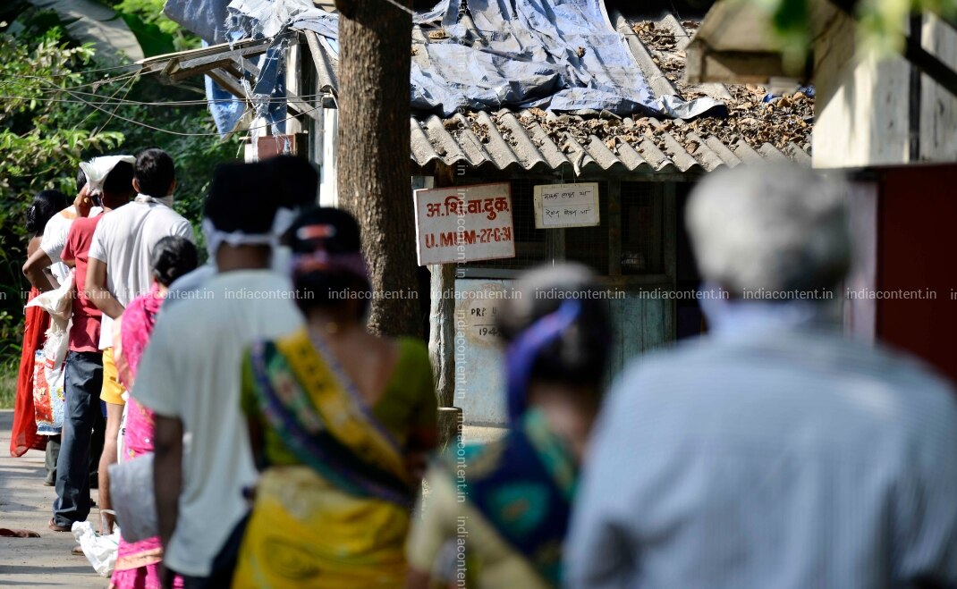 Buy People stand in queue at a Ration Shop Pictures, Images, Photos By ...