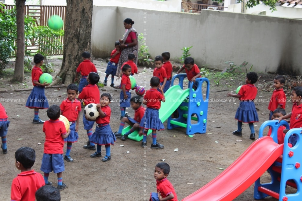 Buy Children of both indigenous tribes and forest officers play ...